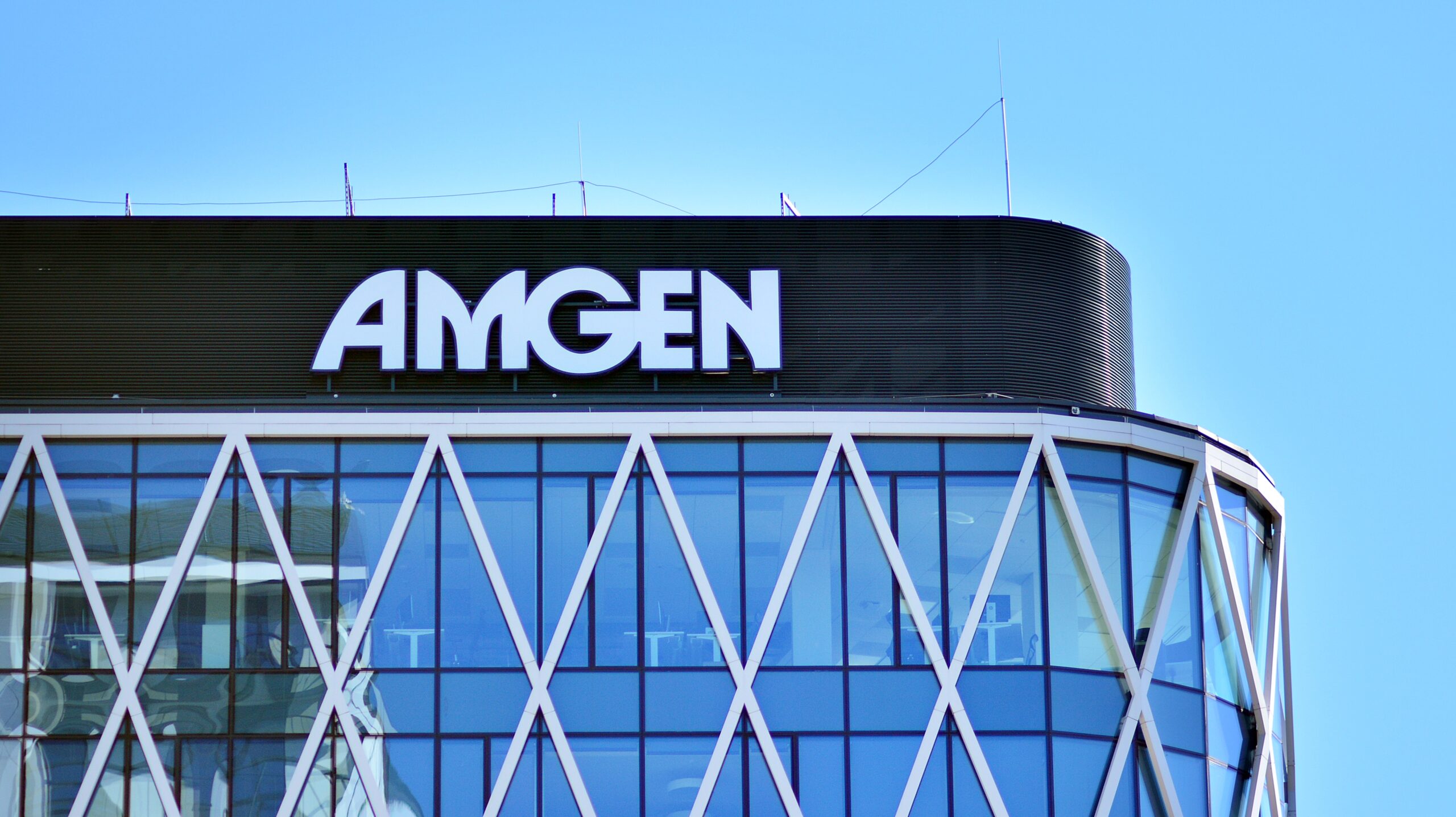 Amgen (AMGN) Stock: Rises on $840M Dark Blue Therapeutics Acquisition Deal